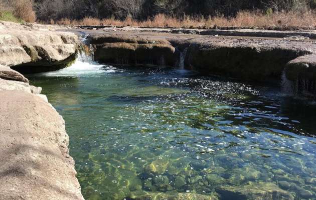 Take a Hike to This Stunning 40-Foot Waterfall & Cave Near Austin, TX ...