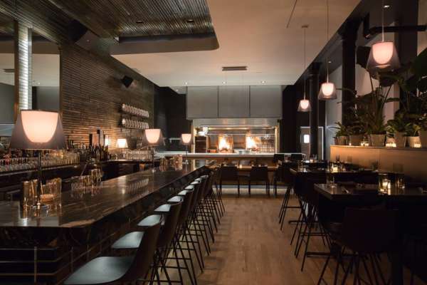 Cozy Up in Front of El Che Bar's One-of-a-Kind Fireplace | UrbanMatter